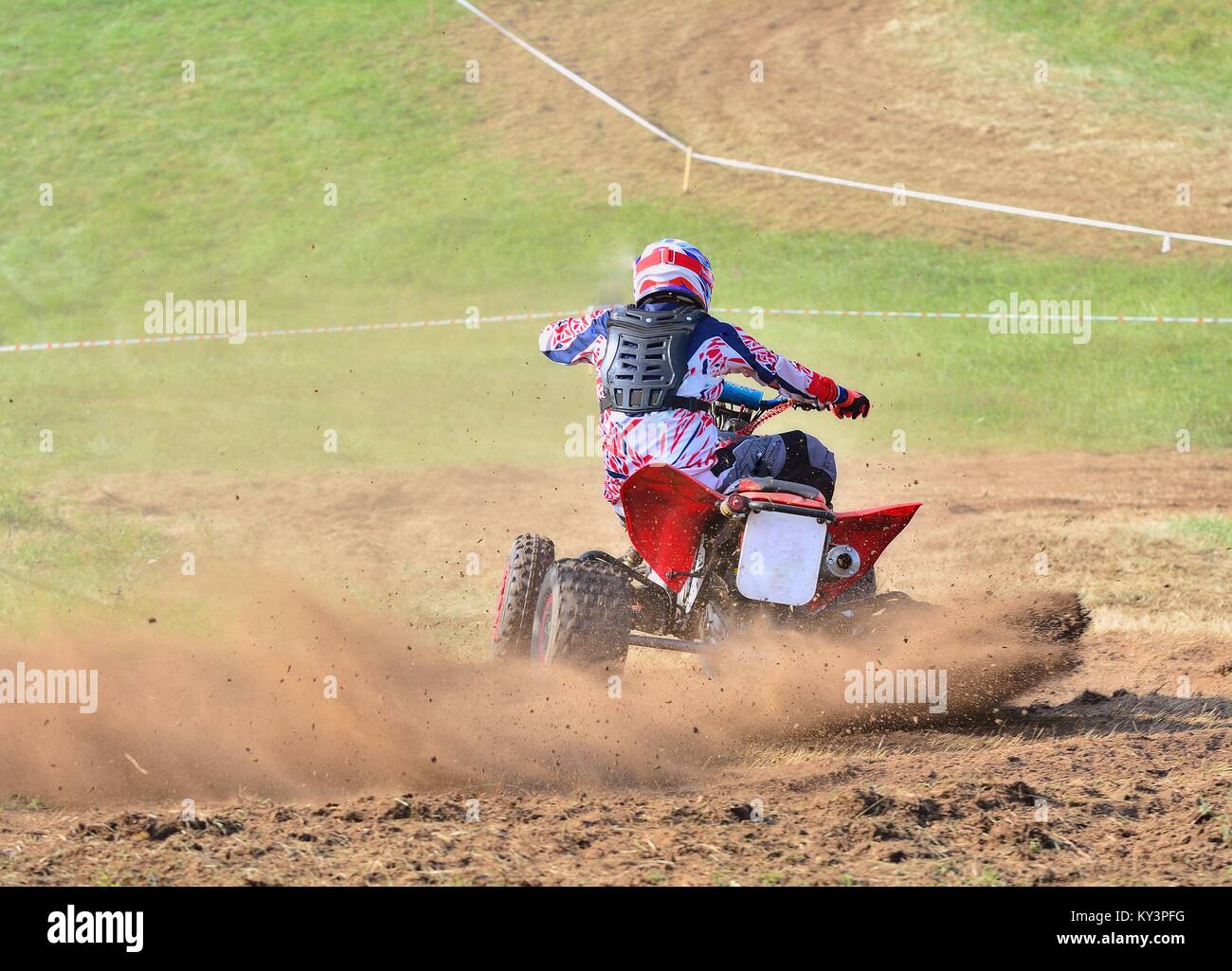 Rear view of a driver on a quad motorbike Stock Photo - Alamy