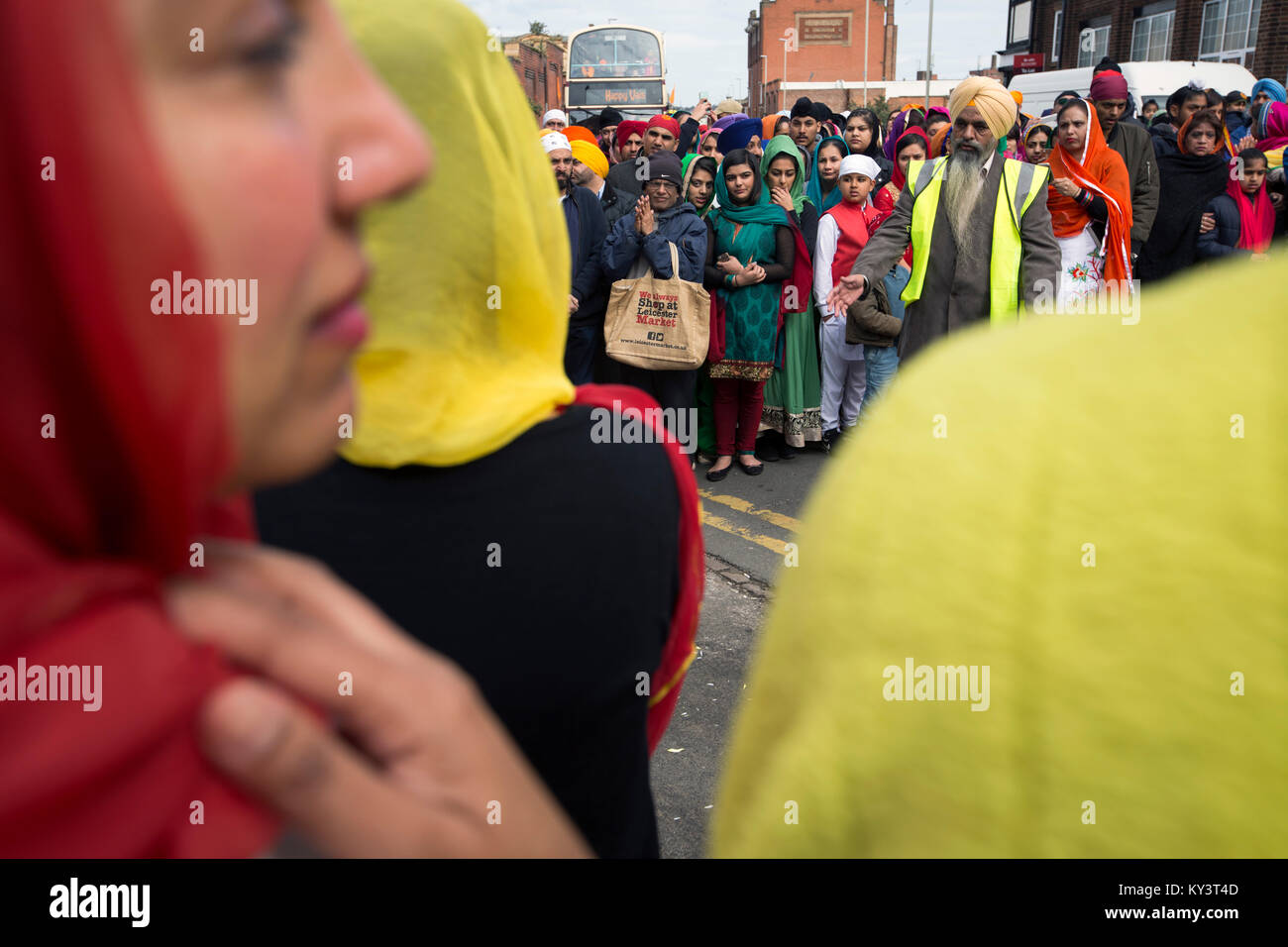 People watching a bi-annual Sikh religious procession through the ...