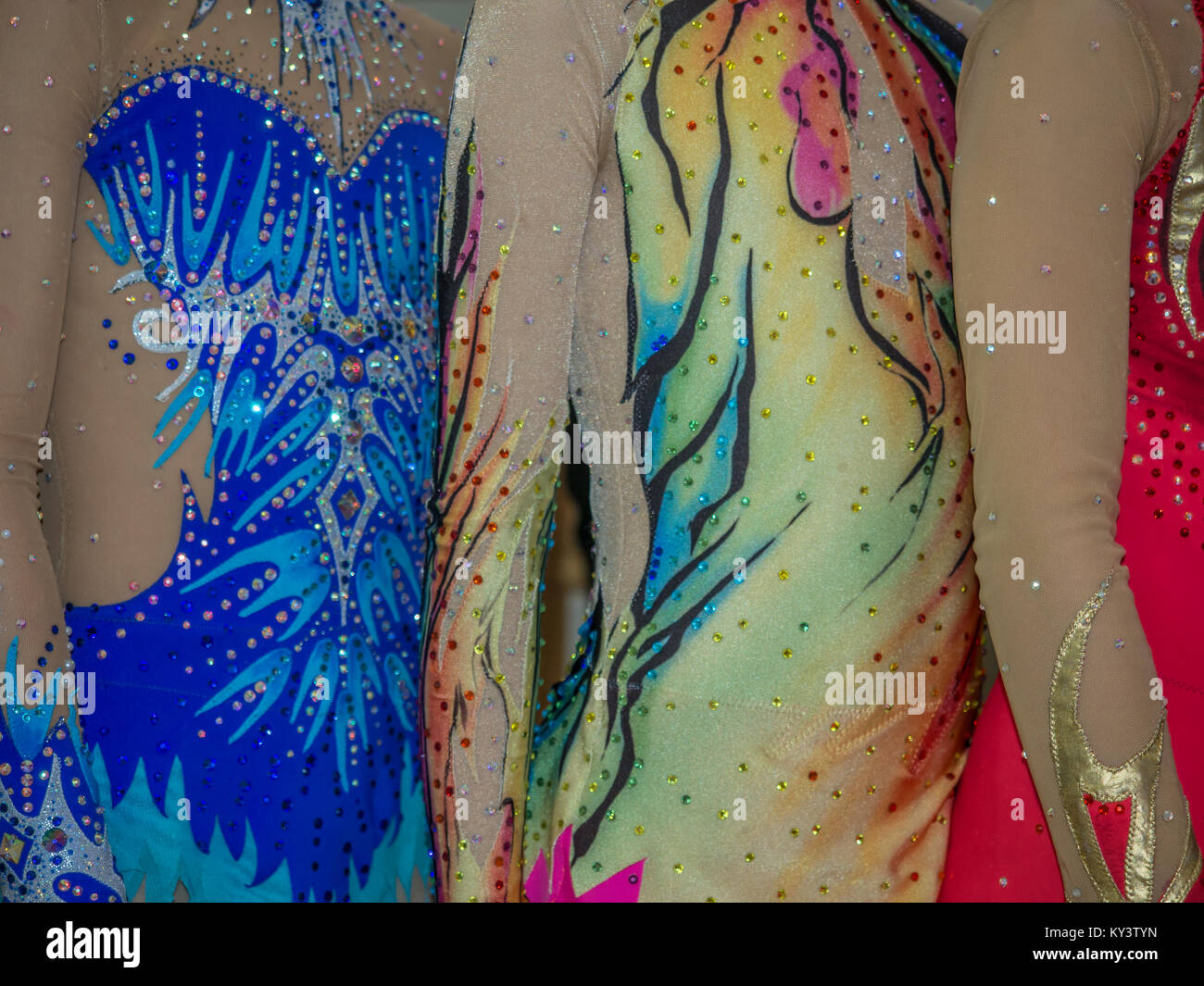 Background, texture. Colorful costumes of young girls exercise ...