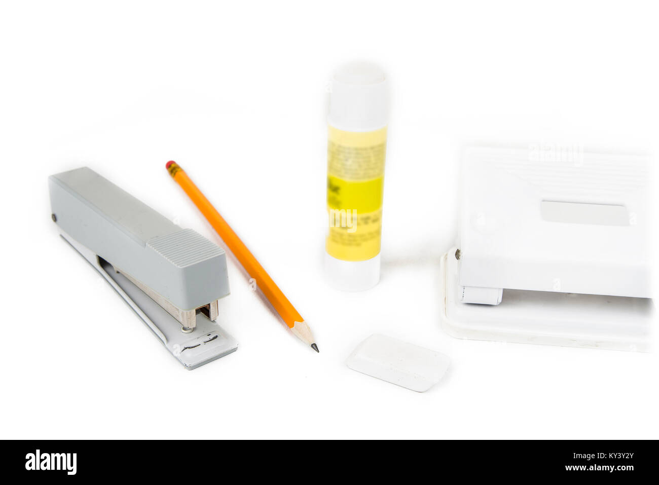 Pencils and sharpener with stapler and puncher Stock Photo - Alamy