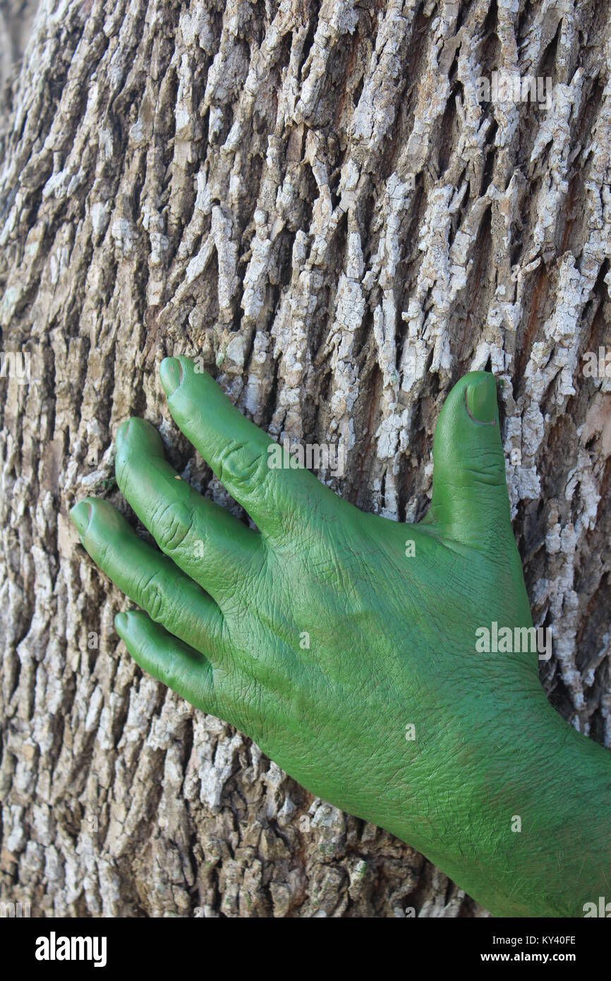 Creature Green Hand on Tree Stock Photo - Alamy
