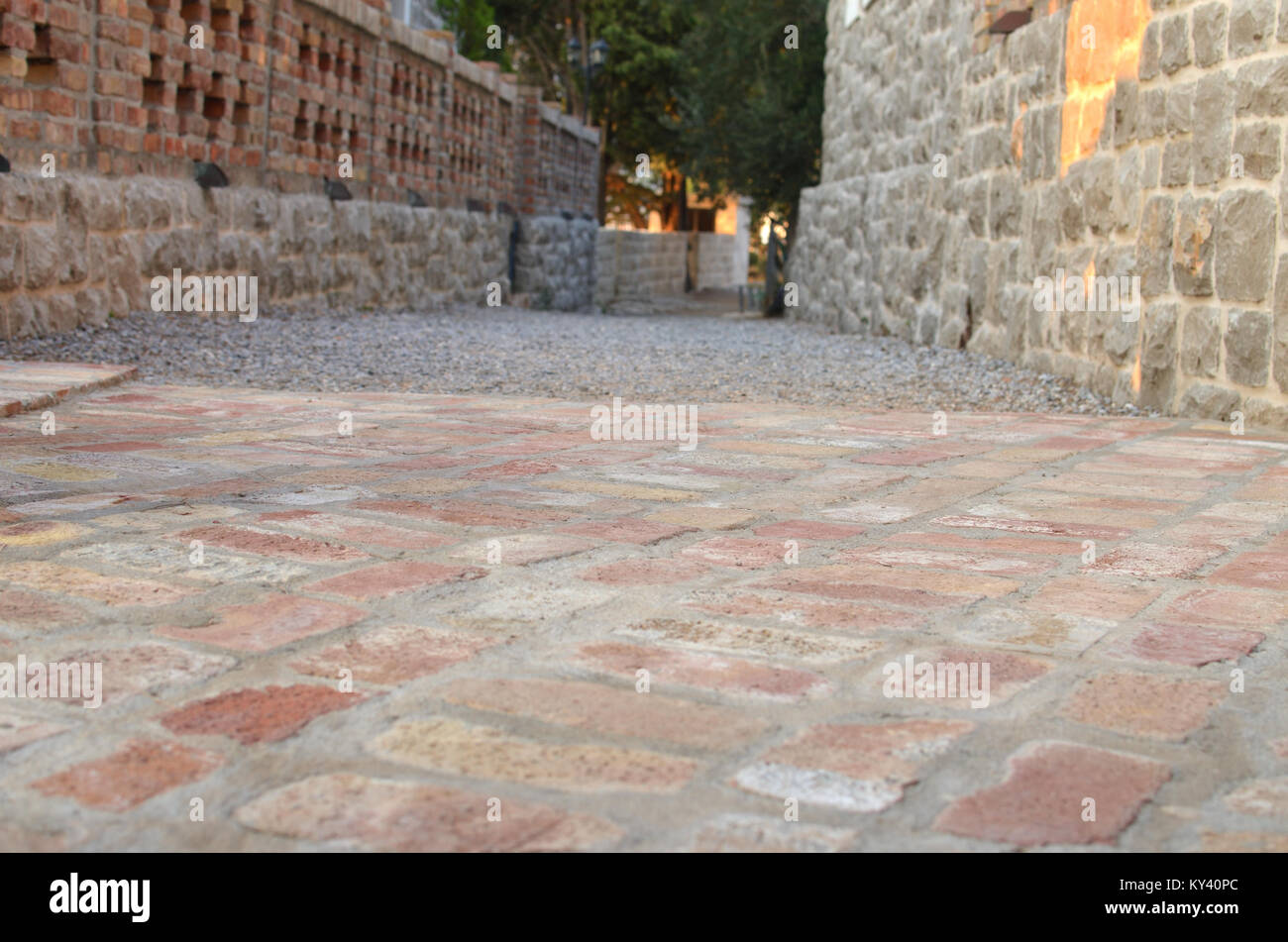 Path made of bricks and cobblestones in a coastal small town Stock ...