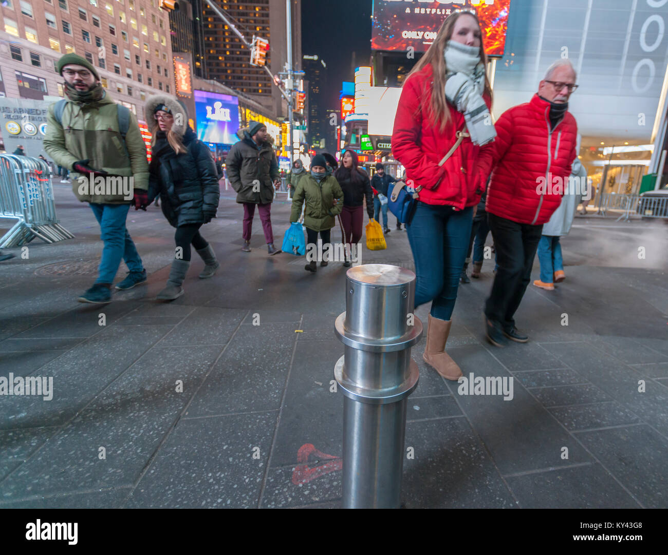 Visitors to Times Square in New York on Tuesday, January 3, 2018 pass ...