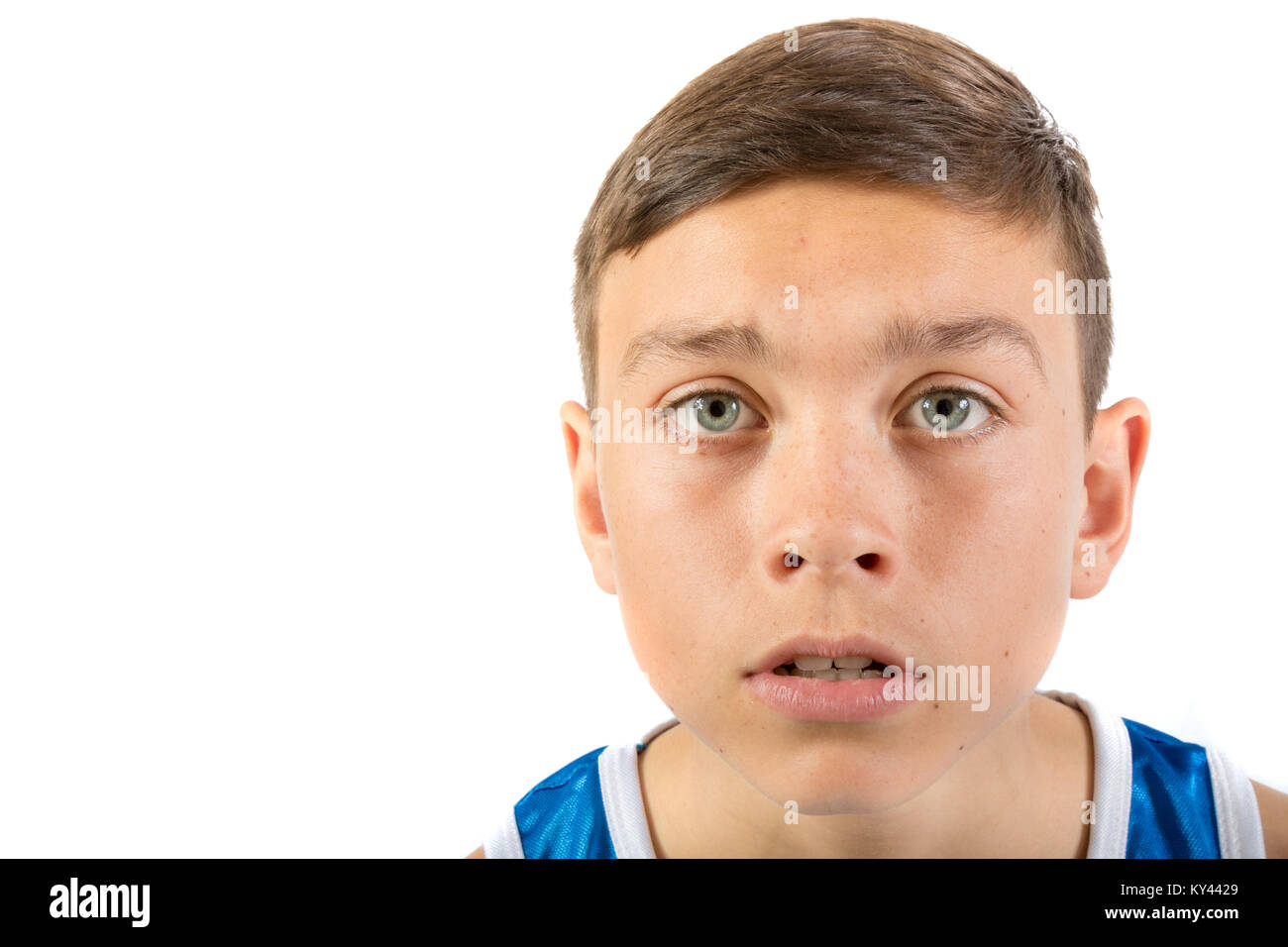 Teenage boy headshot looking scared agaisnt a white background Stock ...