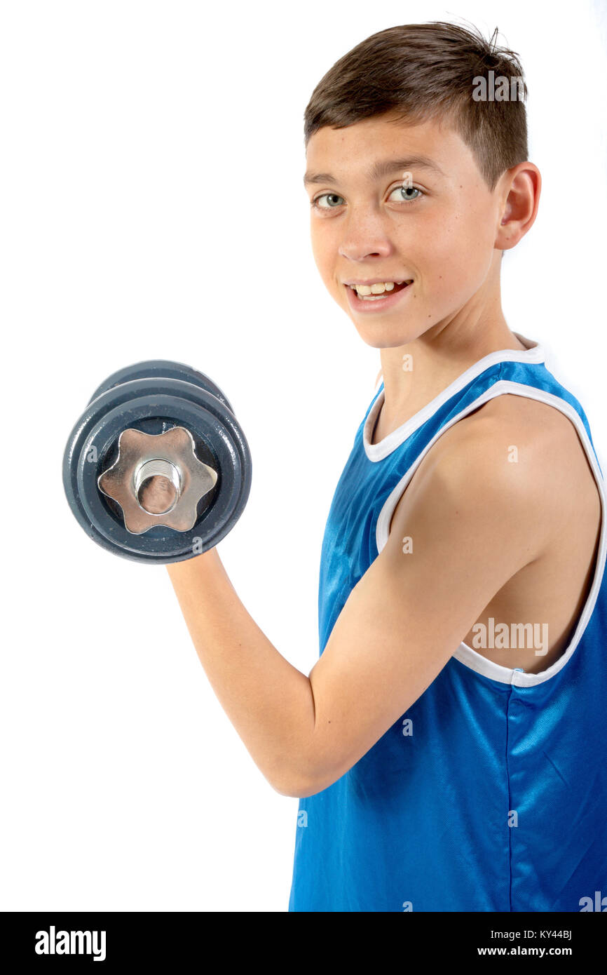 Young teenage boy exercising with dumbbells isolated against a white ...