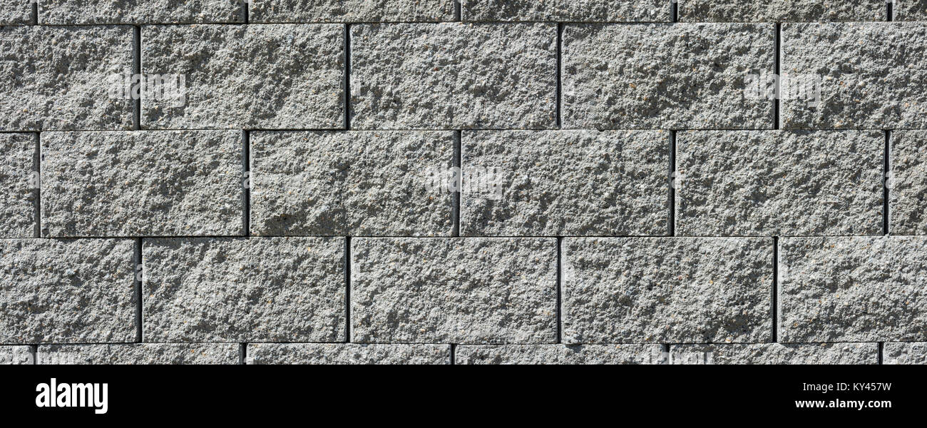Gray wall from stone bricks. Beautiful wide-angle texture from concrete ...