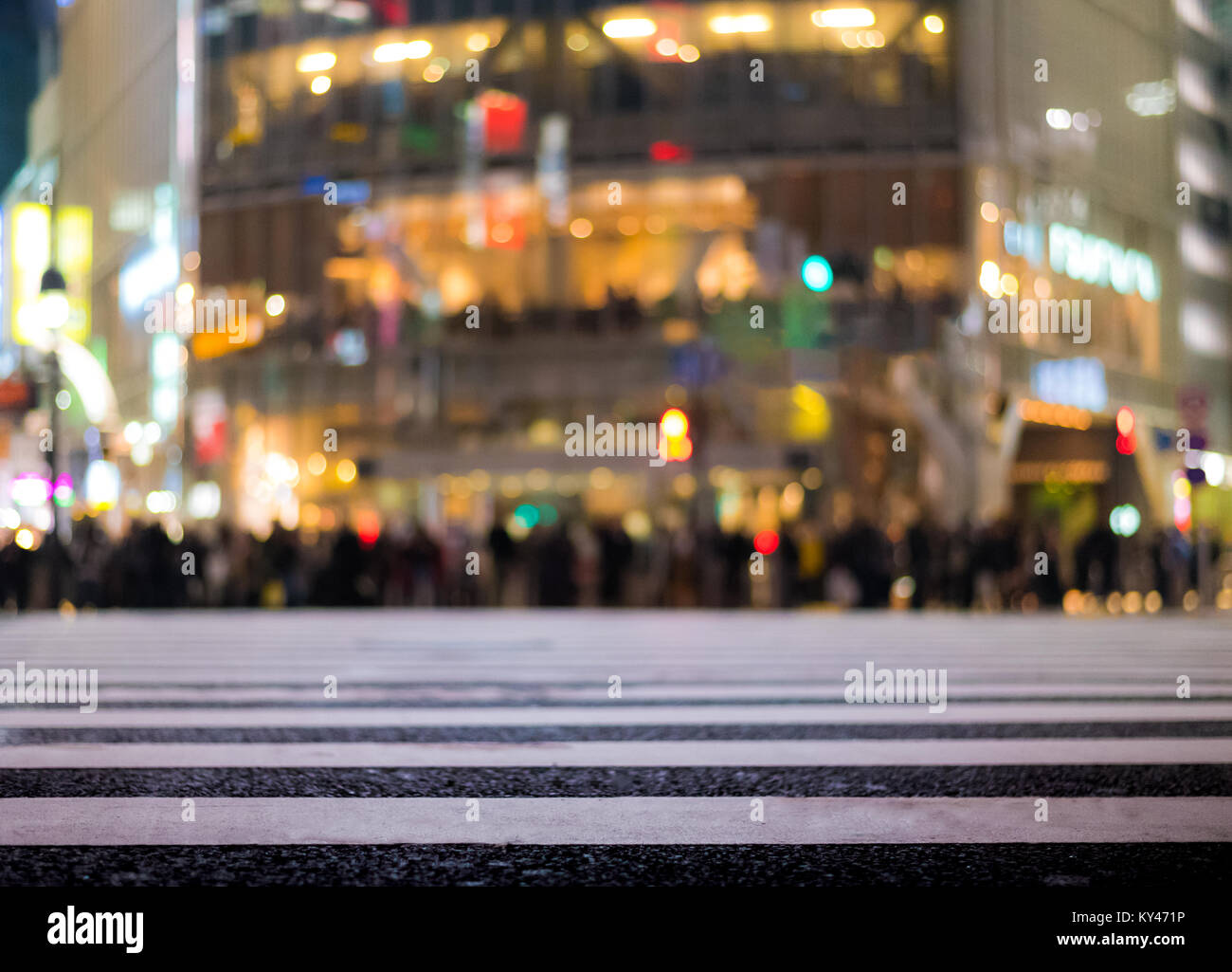 focus on street with blurred background of crowded people at shibuya ...