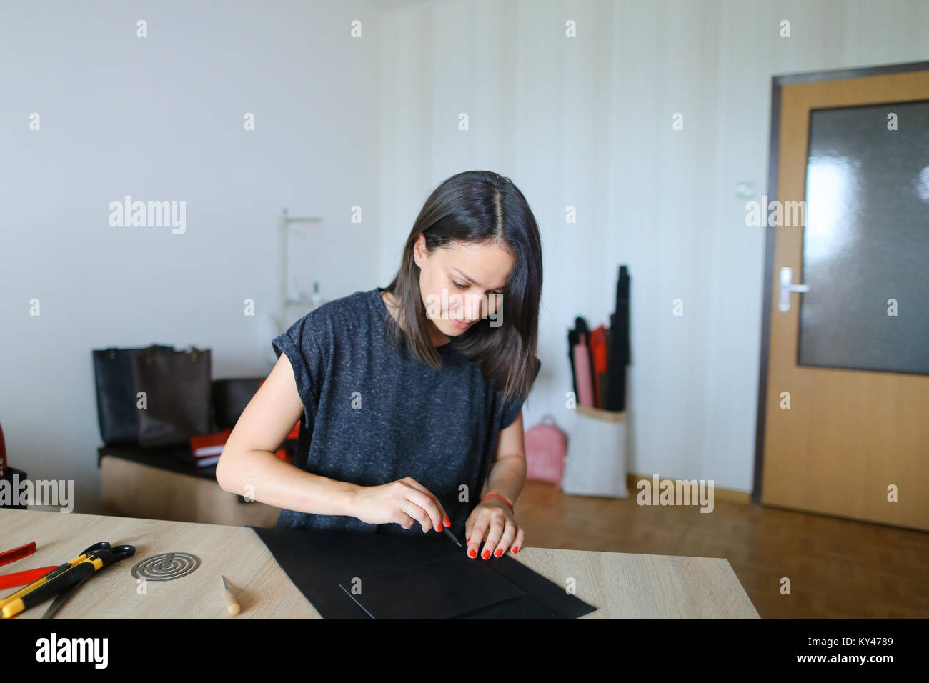 young designer making women bags for sale Stock Photo - Alamy