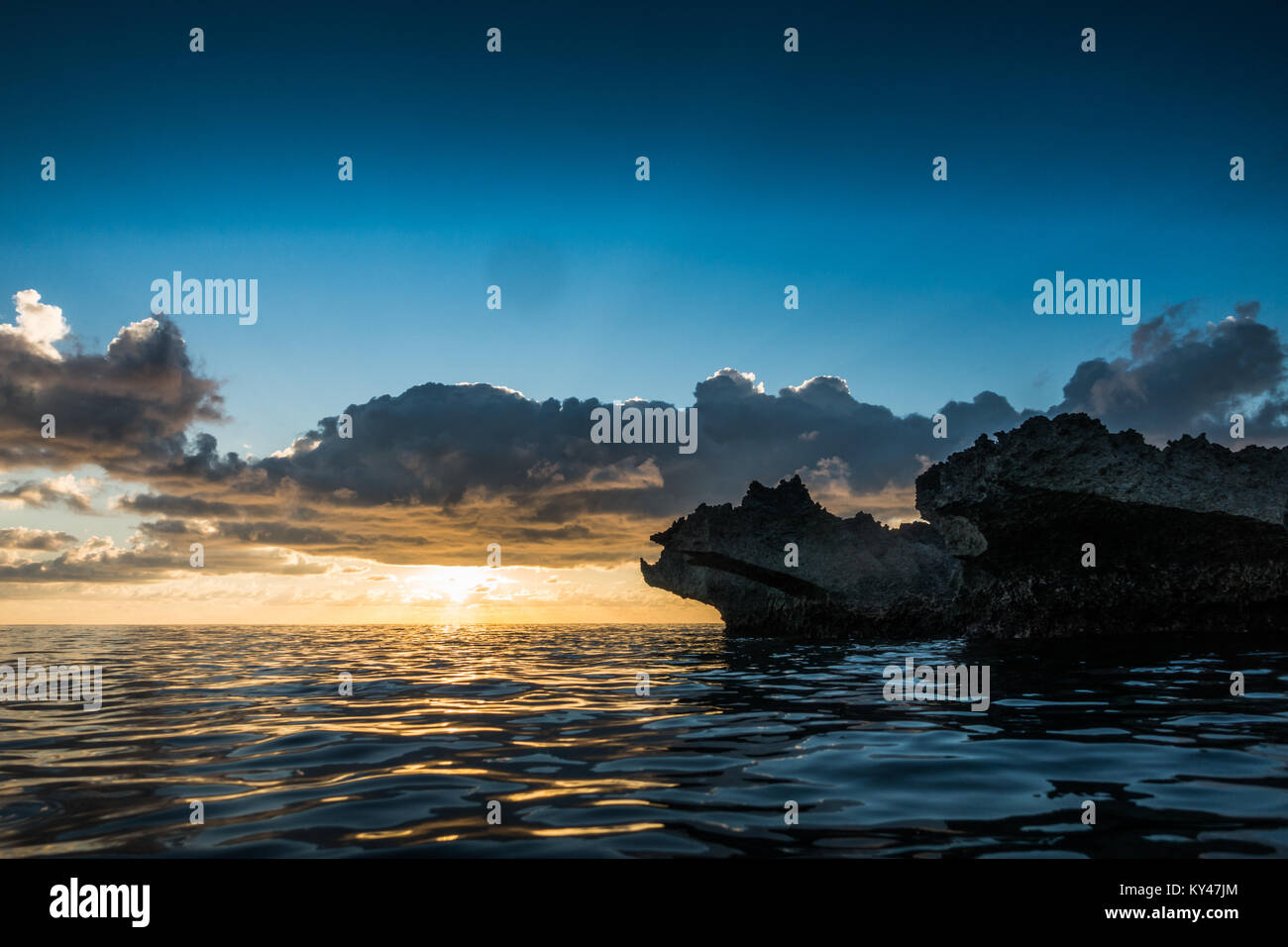 View to big volcanic rocks in sunset lights in San-Andres island ...