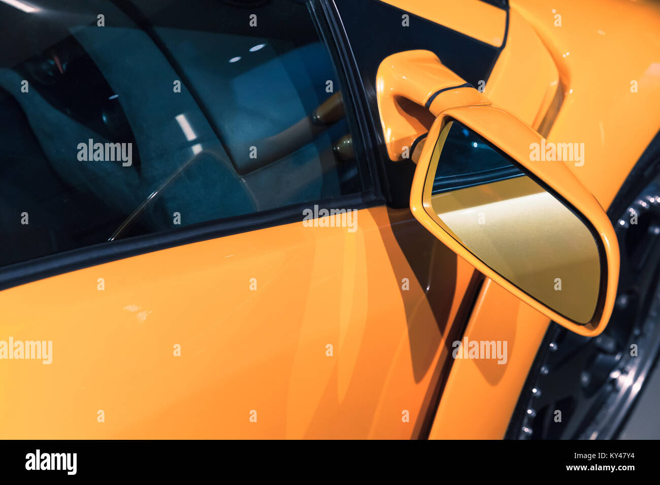 Luxury yellow sports car mirror, closeup photo Stock Photo - Alamy