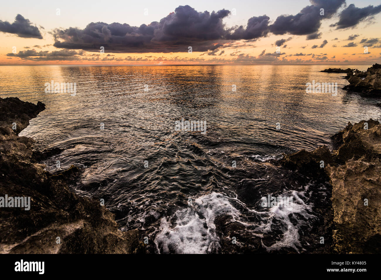 View to big volcanic rocks in sunset lights in San-Andres island ...