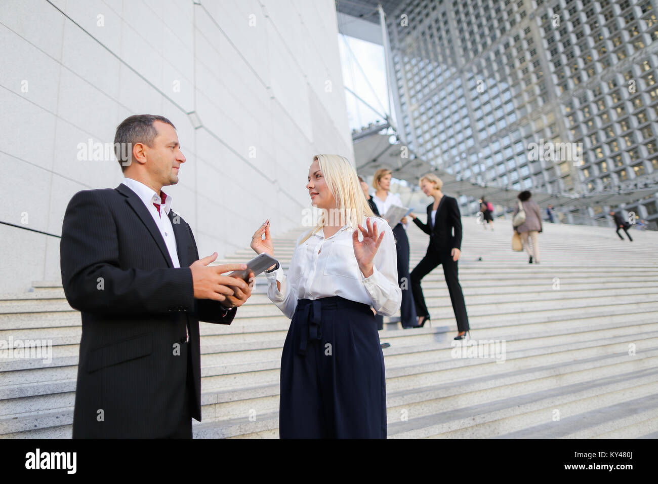 Foreign business colleagues in official journey talking and keep Stock ...