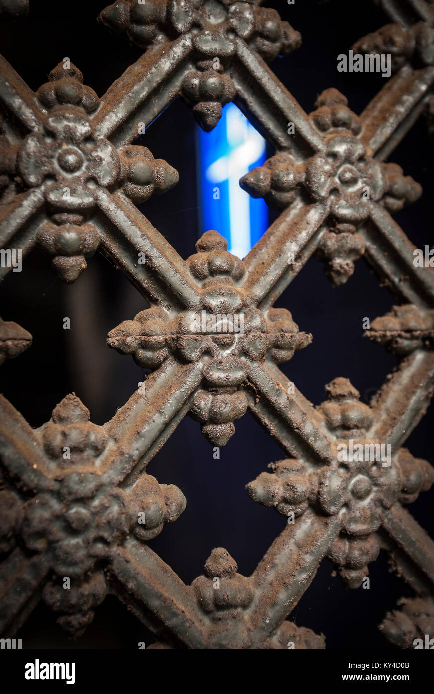 The image of cross seen through the door of a crypt at Montmartre ...