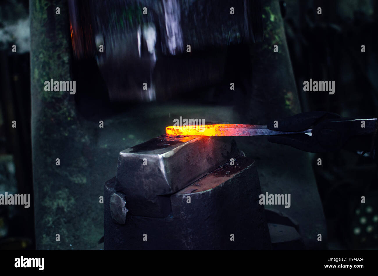 Blacksmith at work, hit with a hammer by a hot metal on the anvil Stock ...