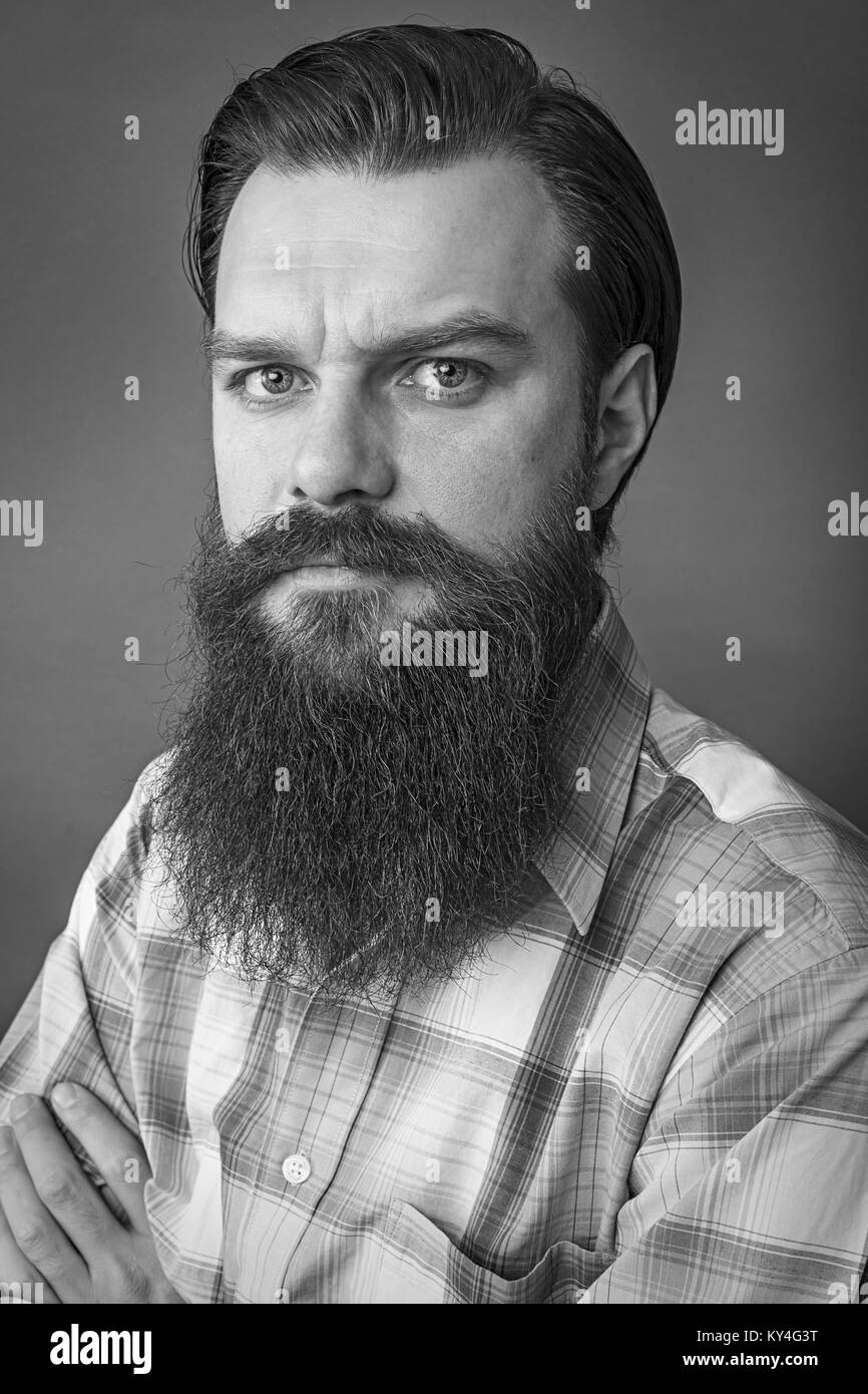 Portrait handsome bearded man looking Black and White Stock Photos ...
