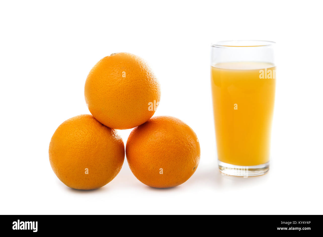 portrait of fresh sunkist orange with a glass of orange juice isolated ...
