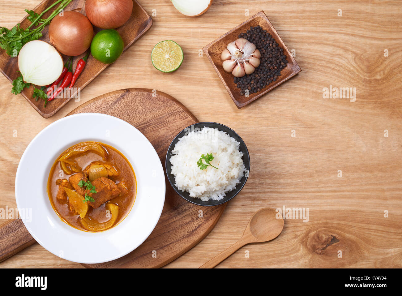Chicken curry with spice on wooden background Stock Photo - Alamy