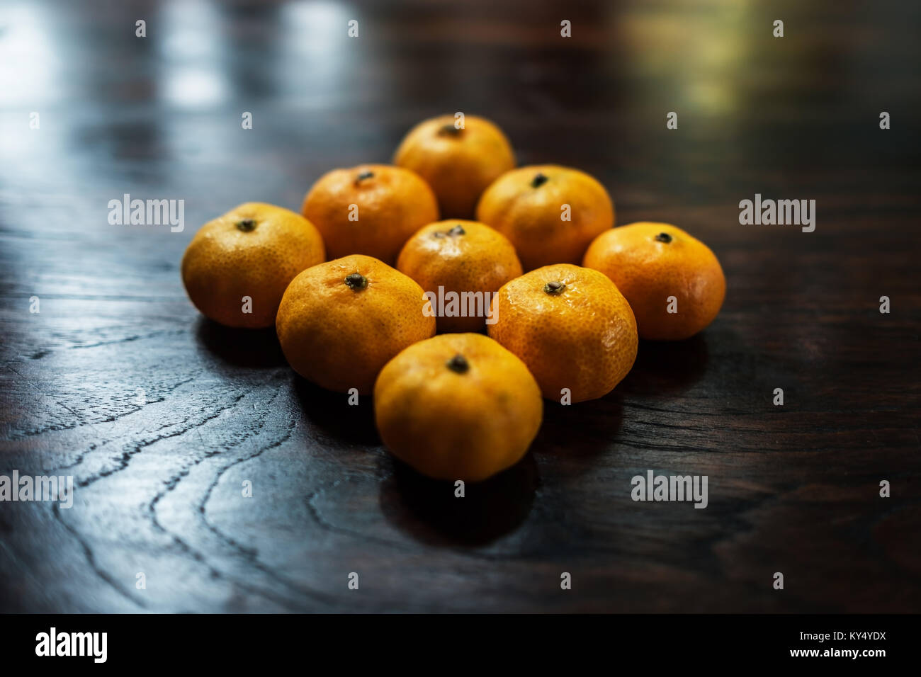 mandarin on wooden table Stock Photo - Alamy