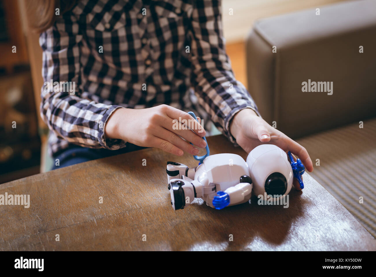 Girl fixing the robotic toy Stock Photo - Alamy