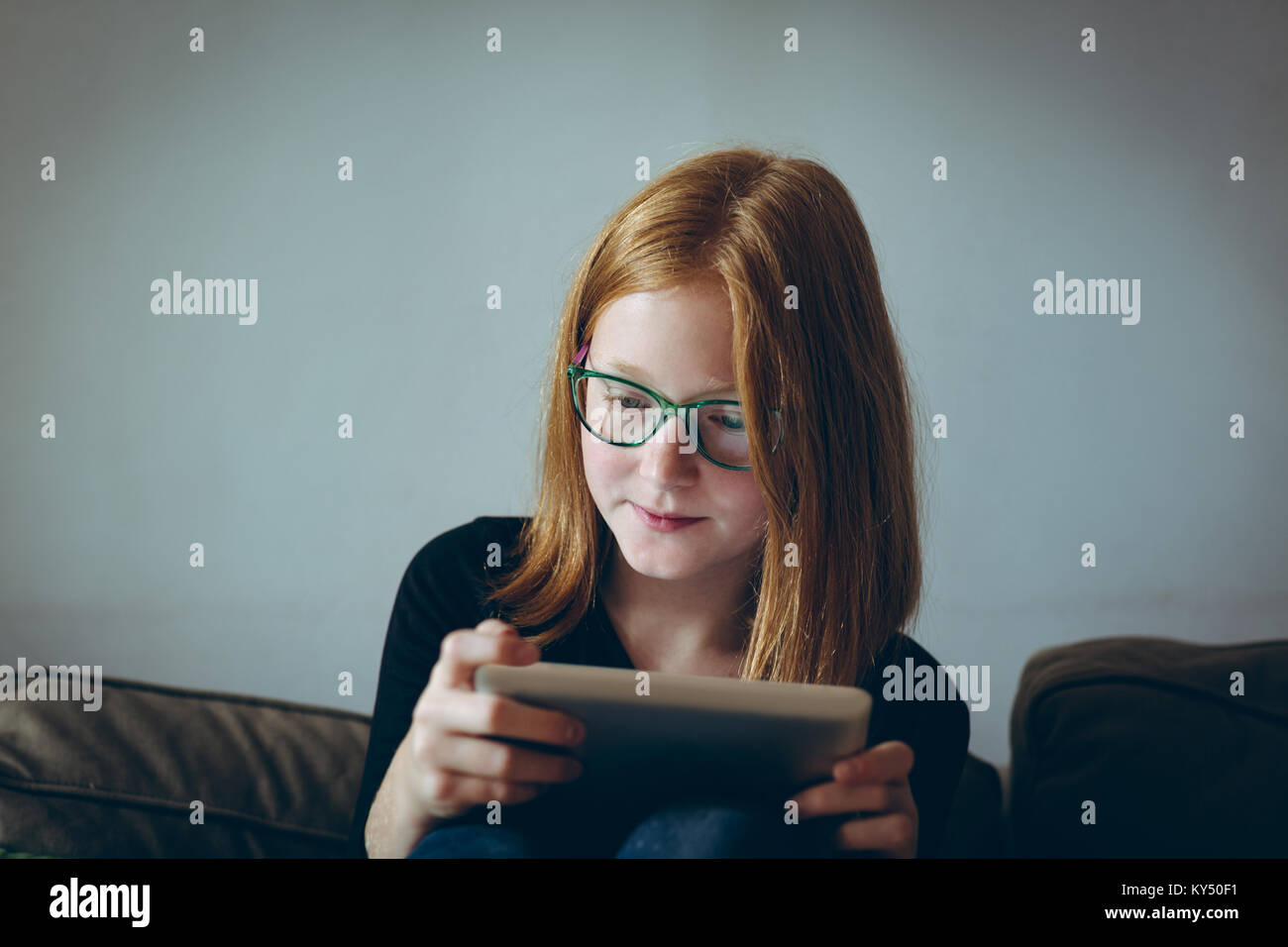 Girl using digital tablet Stock Photo - Alamy