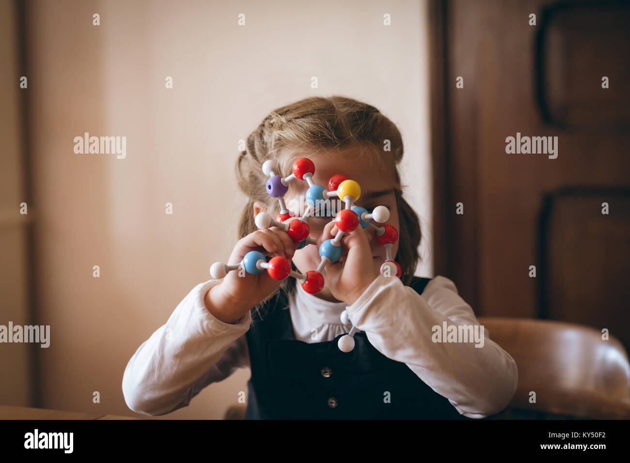 Girl experimenting with molecule Stock Photo - Alamy