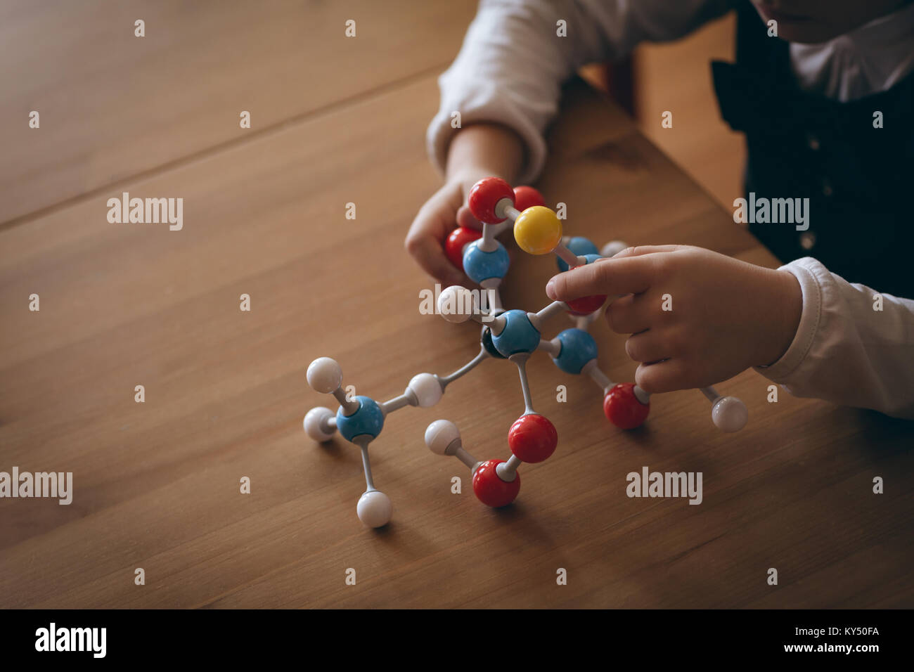 Girl experimenting with molecule Stock Photo - Alamy