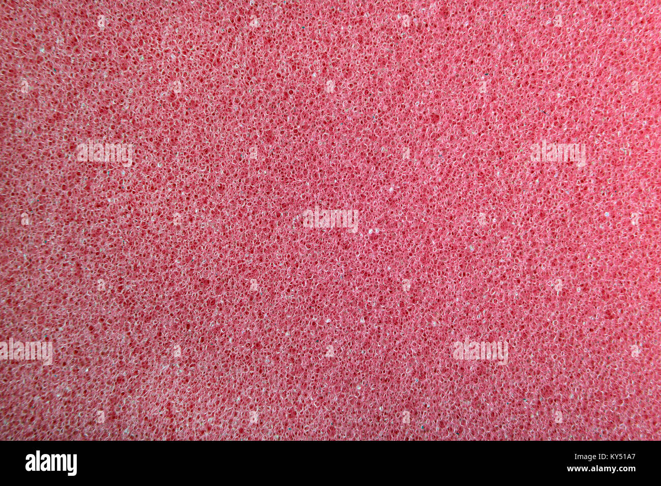 Pink texture of a surface of a scouring sponge close up Stock Photo - Alamy