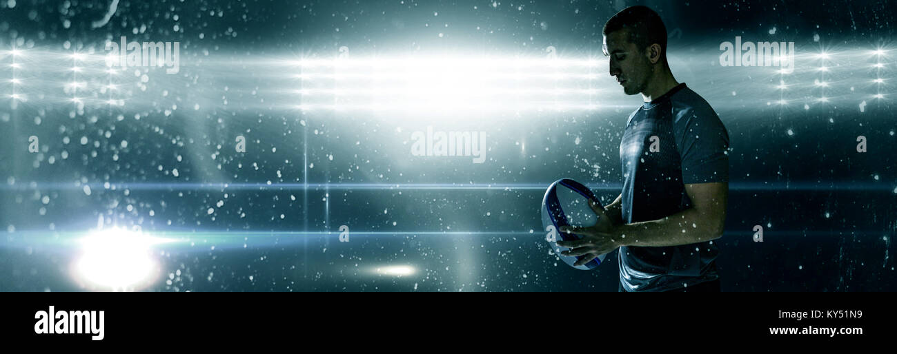 Composite image of calm rugby player thinking while holding ball Stock ...