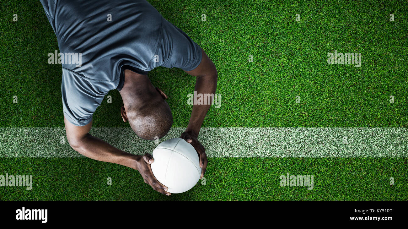 Composite image of rear view of athlete throwing rugby ball Stock Photo ...