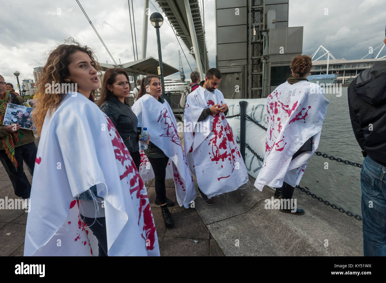 Some Kurds wore bloodstained white sheets for the protest opposite the ...