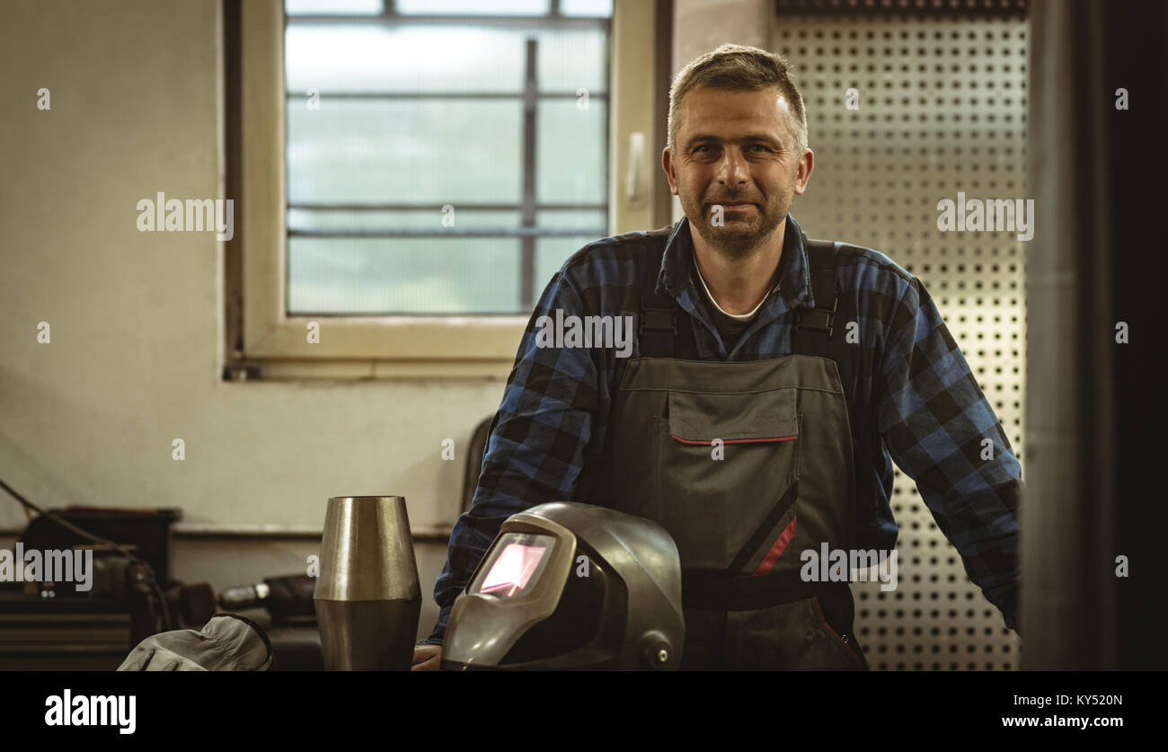 Male worker standing in the factory Stock Photo - Alamy