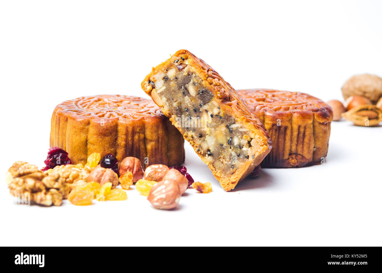 Traditional homemade moon cakes and walnut raisin hazelnut isolated on ...