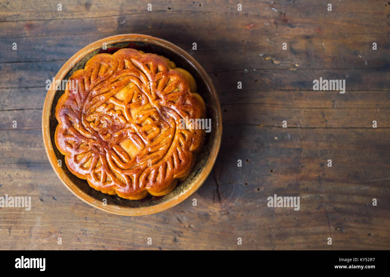 Traditional Chinese moon cake isolated on wooden background Stock Photo ...