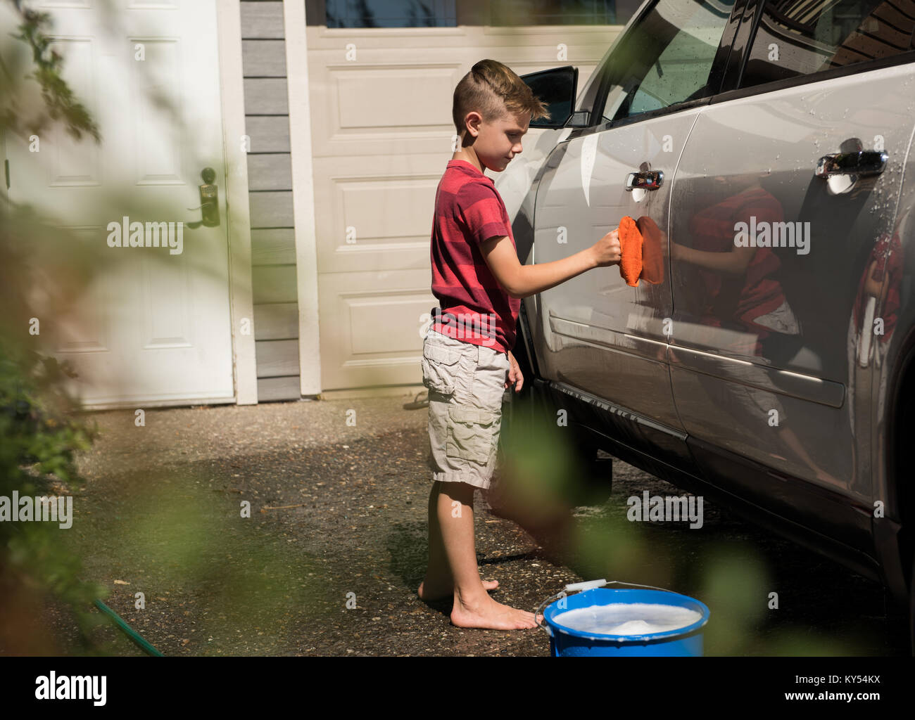 Boy washing car hi-res stock photography and images - Alamy