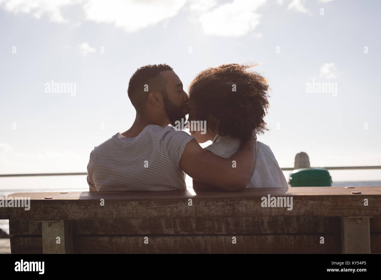 Man kissing woman on forehead Stock Photo - Alamy