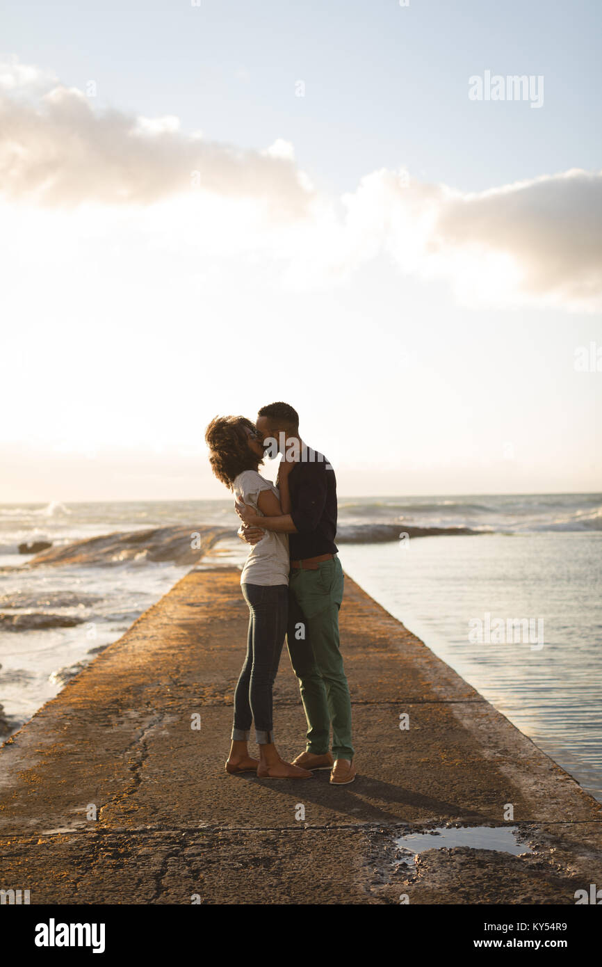Beautiful couple standing together kissing hi-res stock photography and ...