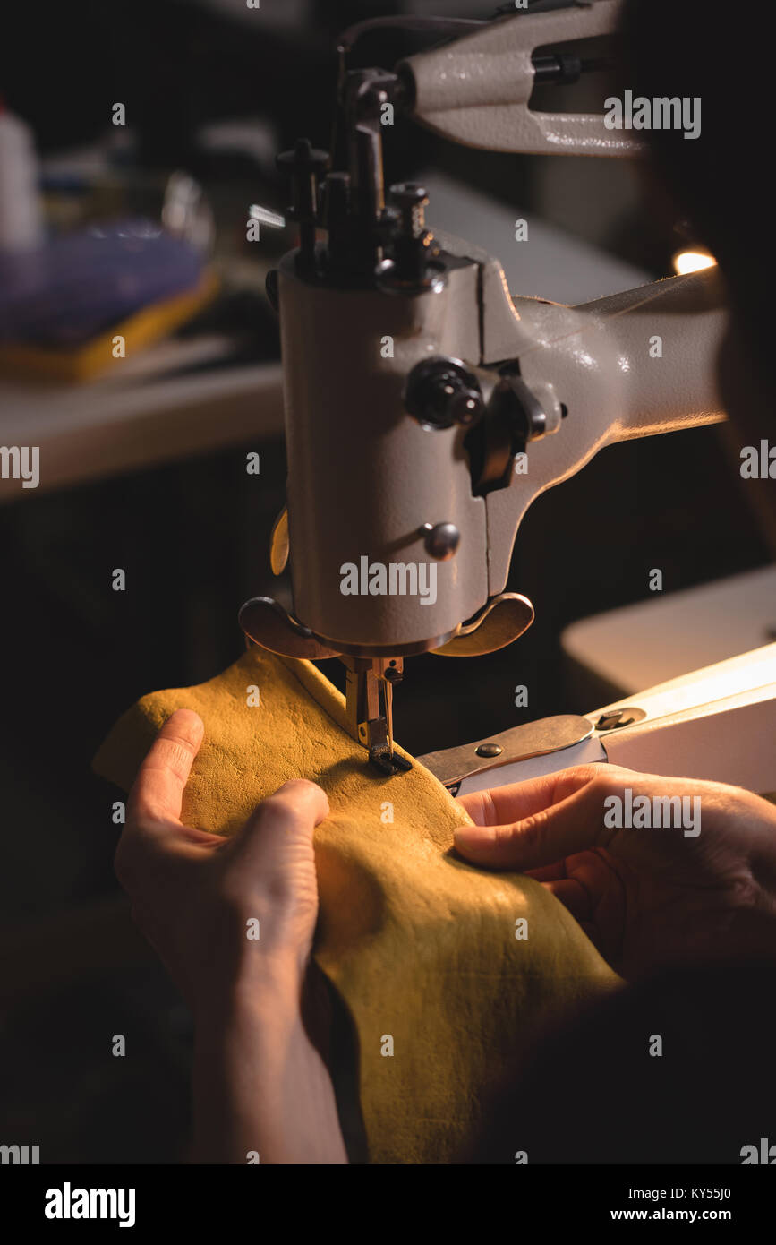 Tailor sewing cloth with sewing machine Stock Photo - Alamy