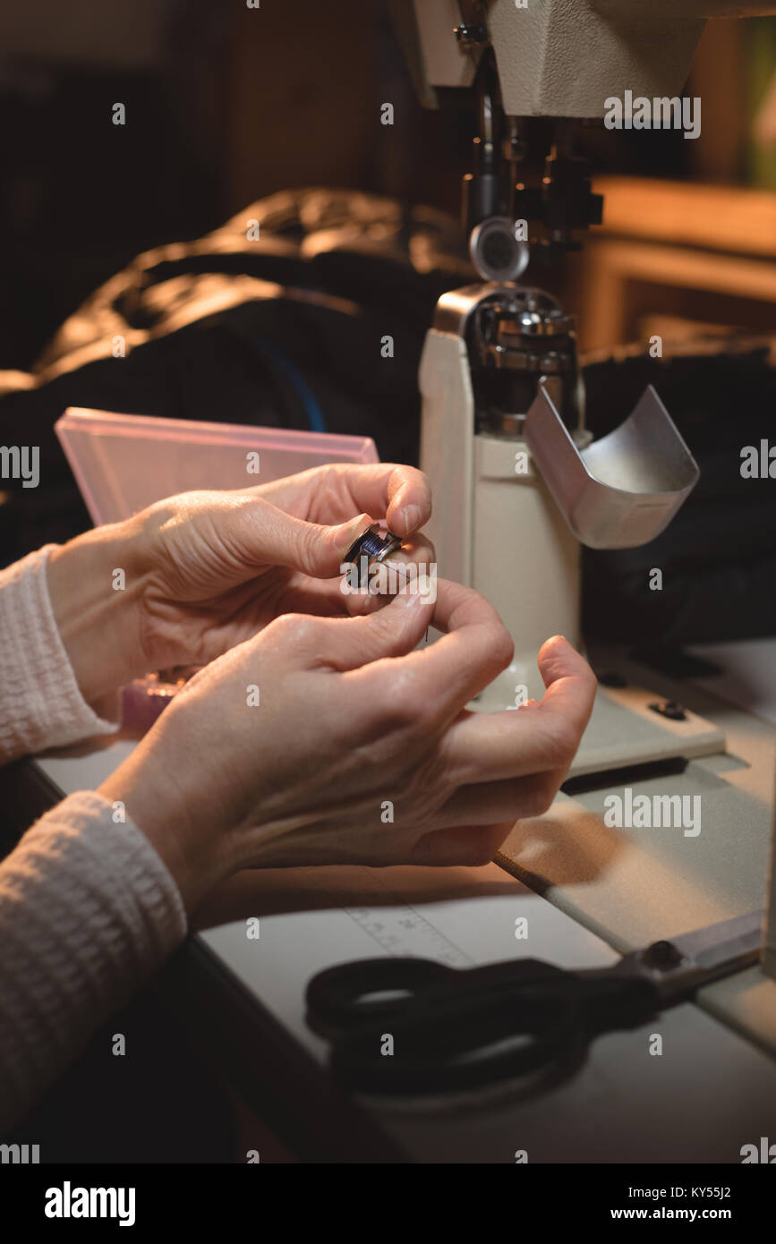 Thread holding needle hi-res stock photography and images - Alamy