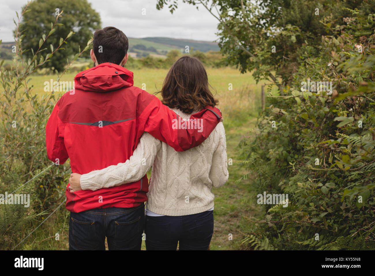 Affectionate standing with arm around Stock Photo - Alamy