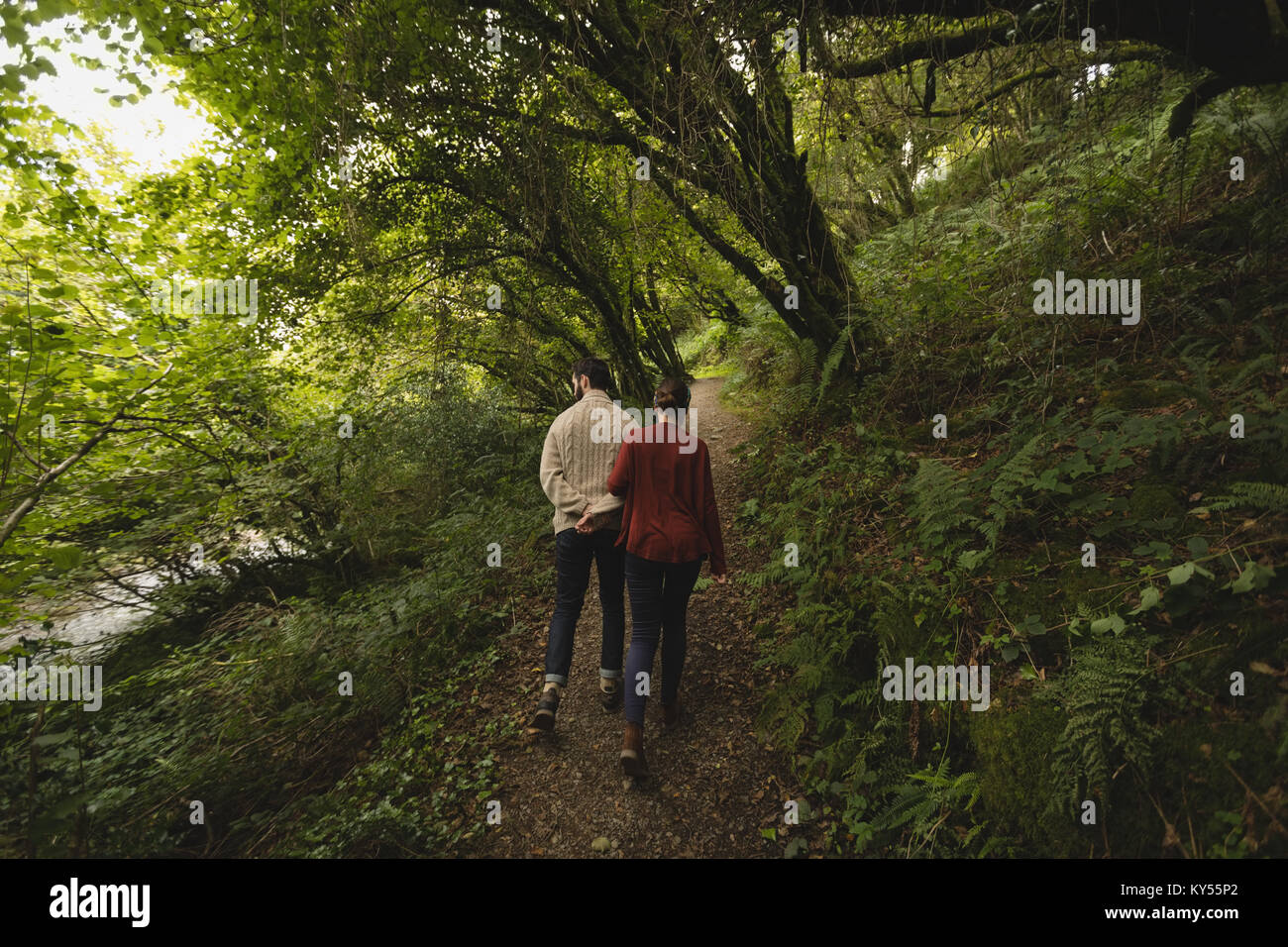 Couple walking on path Stock Photo - Alamy