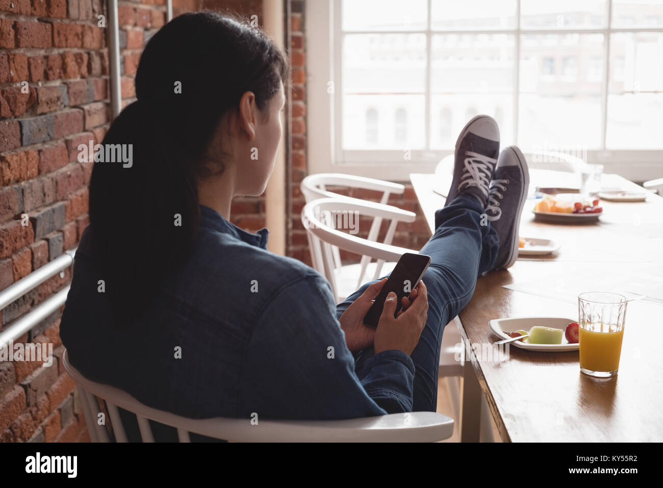 Business woman touching feet hi-res stock photography and images - Alamy