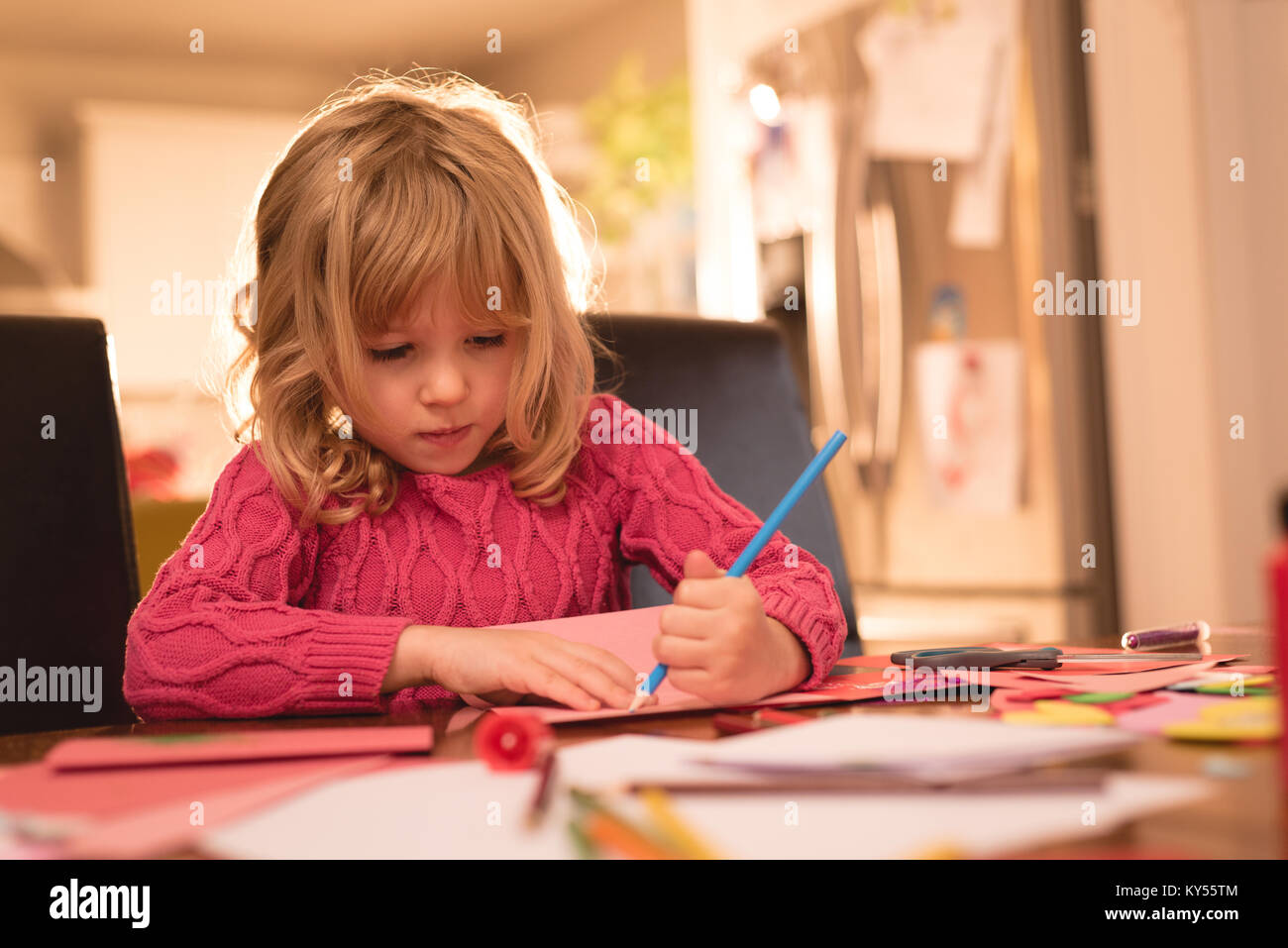 Girl drawing on paper at home Stock Photo - Alamy