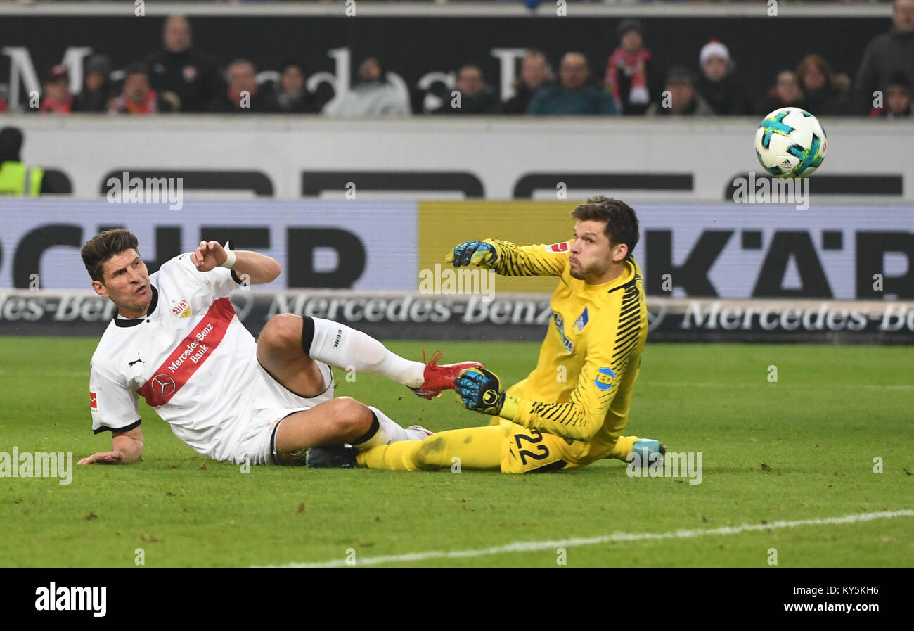 Stuttgart's Mario Gomez (l) shoots for goal beside Berlin goalie Rune ...