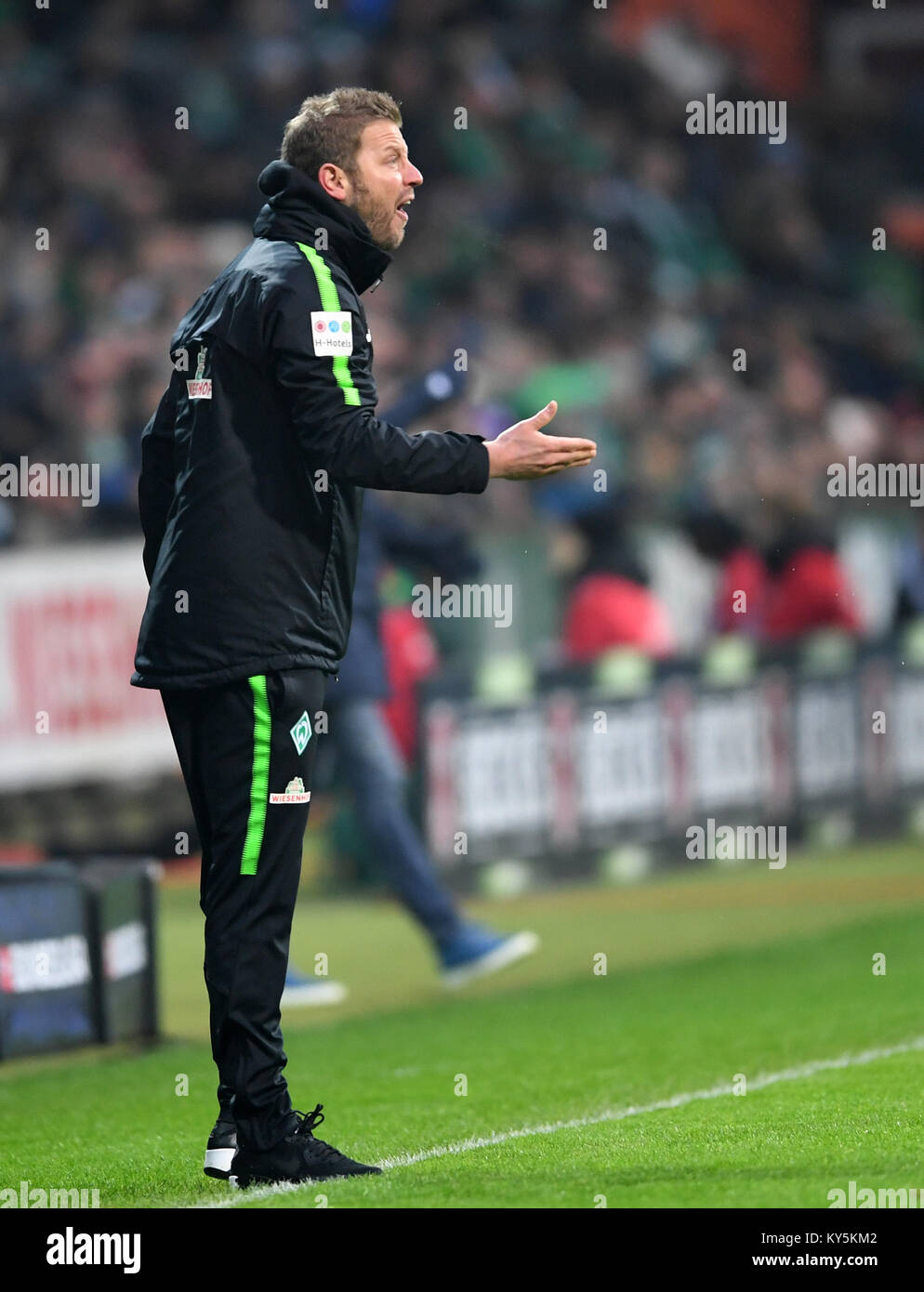 Bremen, Germany. 13th Jan, 2018. Werder coach Florian Kohfeldt gestures ...