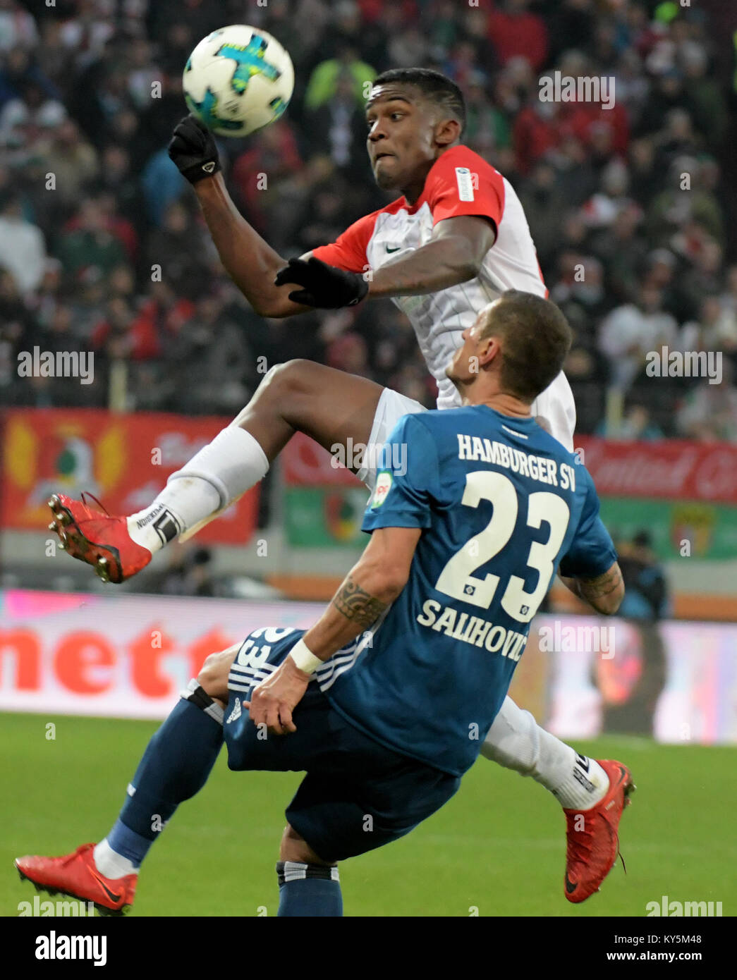 Augsburg's Sergio Cordovar (l) and Sejad Salihovic of Hamburg vie for ...