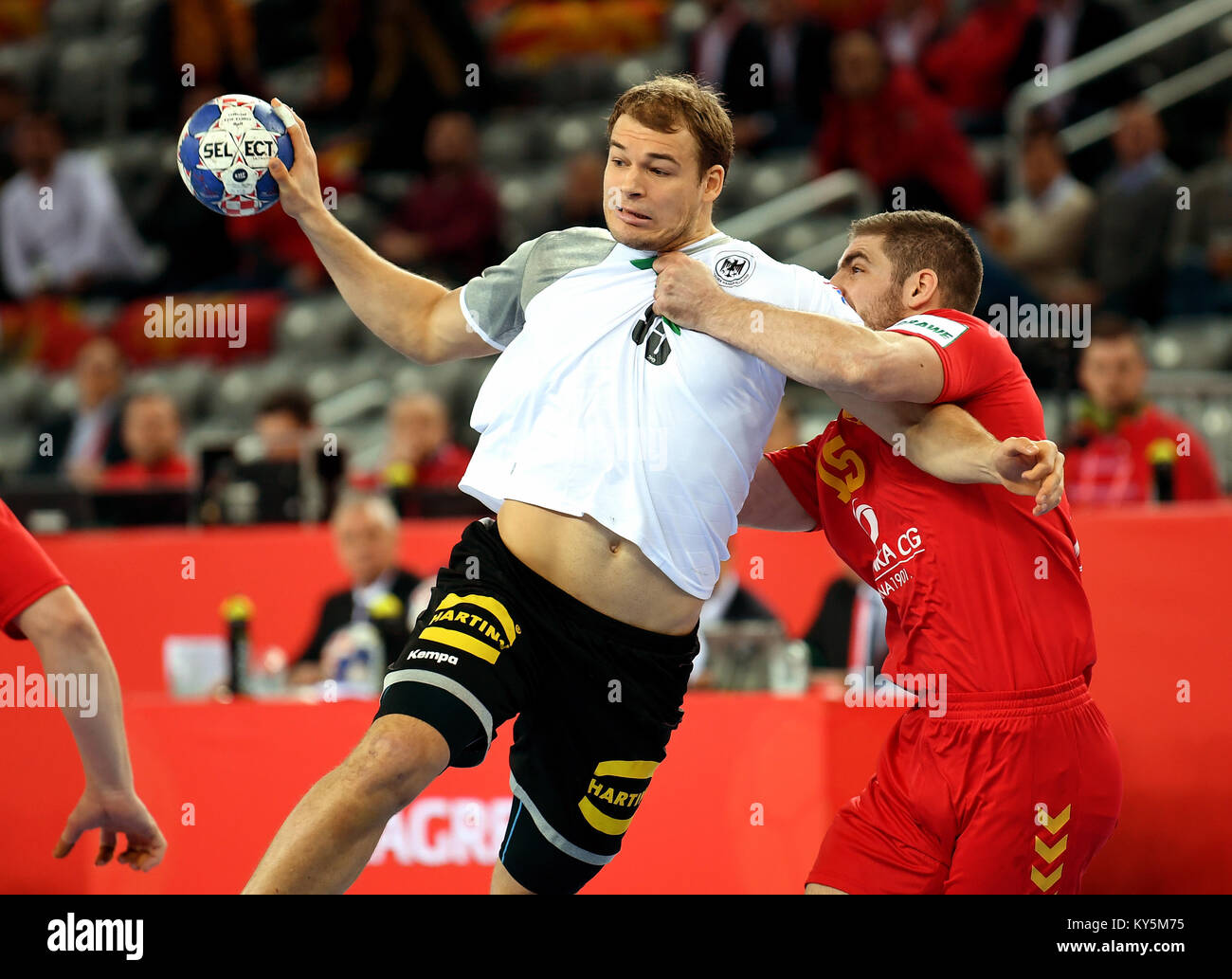 Germany's Paul Drux (l) in action with Montenegro's Igor Radojevic ...