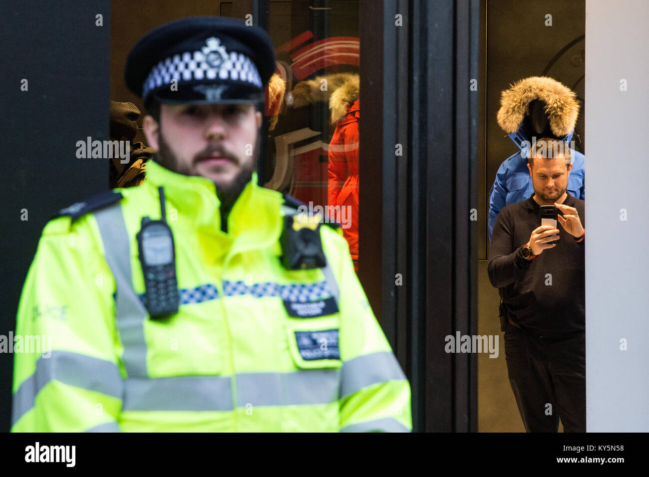 London, UK. 13th Jan, 2018. A man inside Canada Goose's flagship store ...