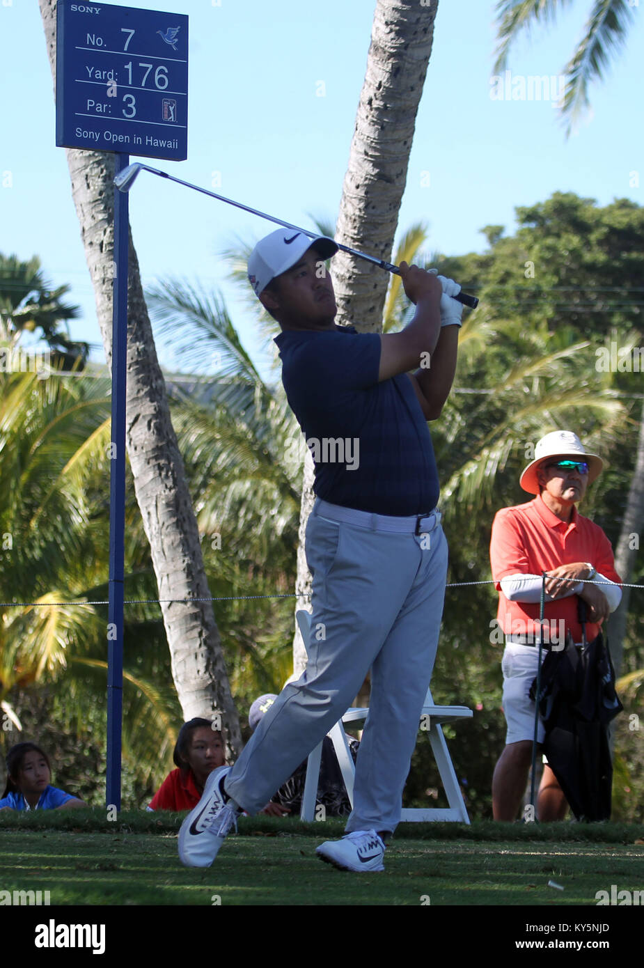 Honolulu, Hawaii. January 12, 2018 - Tyler Ota tees off on the 7th hole ...