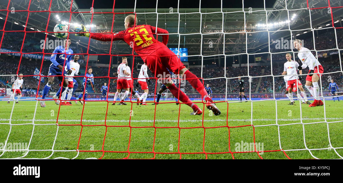 Leipzig goalie Peter Gulacsi is unable to stop the shot by Schalke's ...