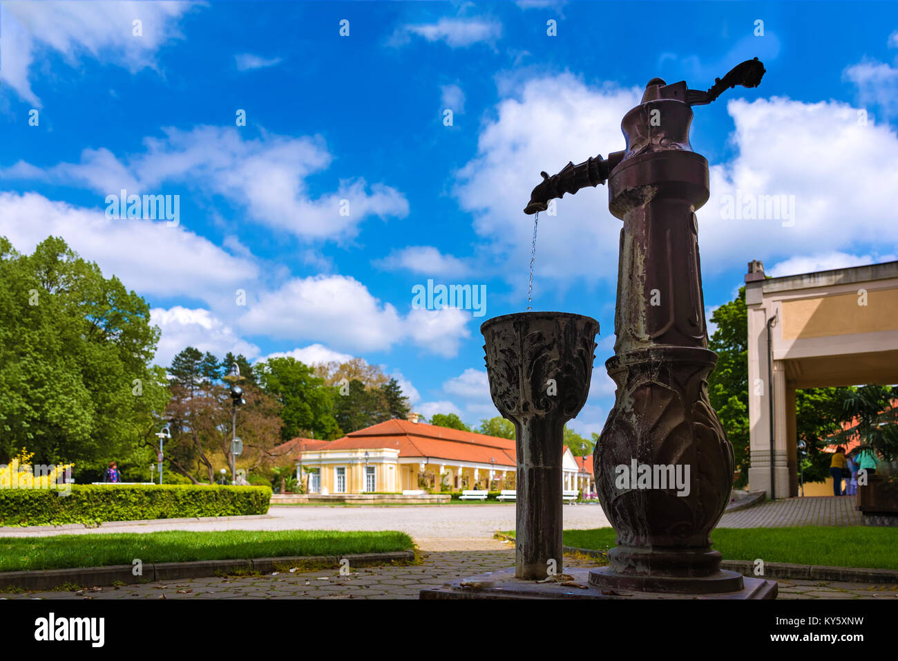 Water fountain and historical building on spa island in Piestany ...
